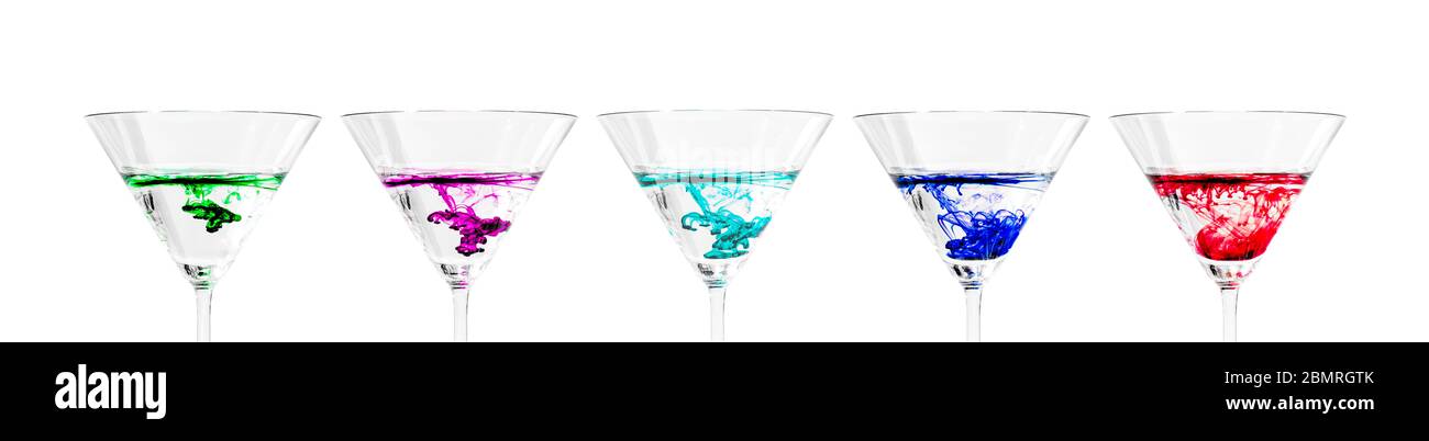 Rainbow of brightly colored drinks of single drop of color as it falls ...