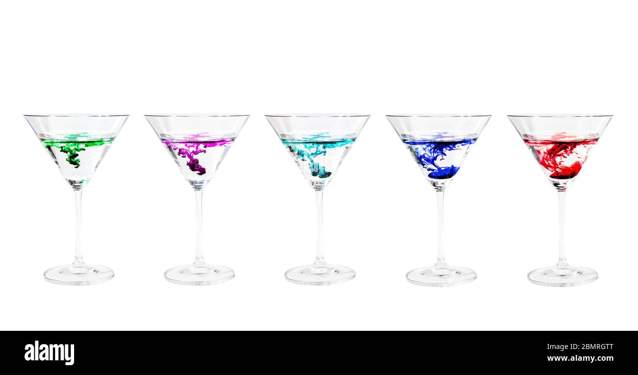 Rainbow of brightly colored drinks of single drop of color as it falls ...