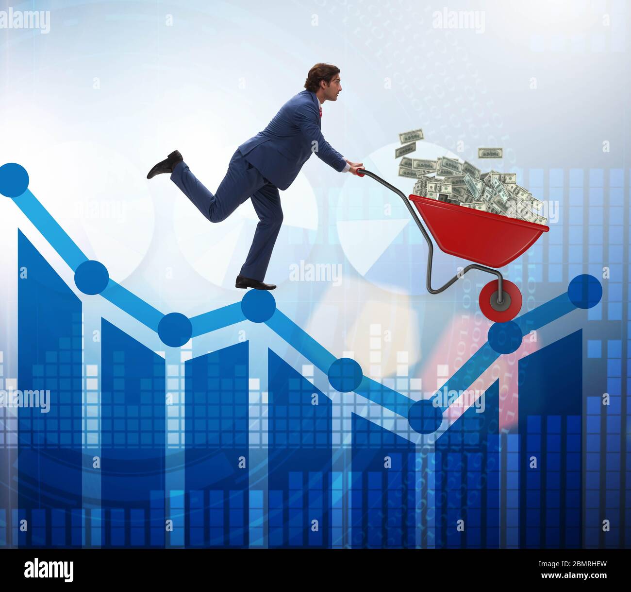 The businessman pushing money wheelbarrow down the chart Stock Photo ...