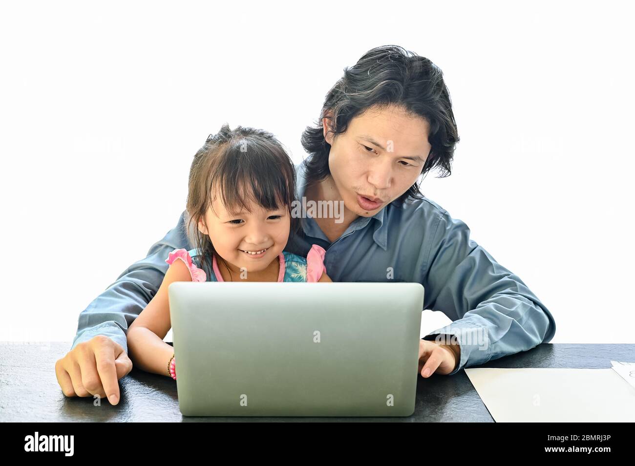 Asian Father and daughter working on laptop. Businessman working from ...
