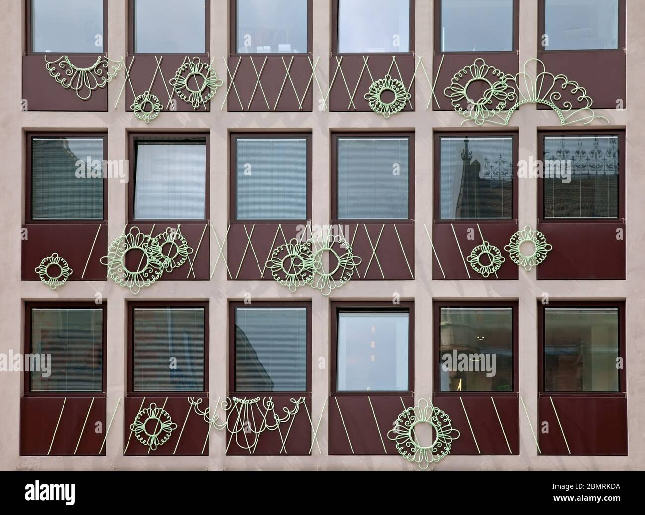 Old building architecture reflected in modern building. Front view of ...