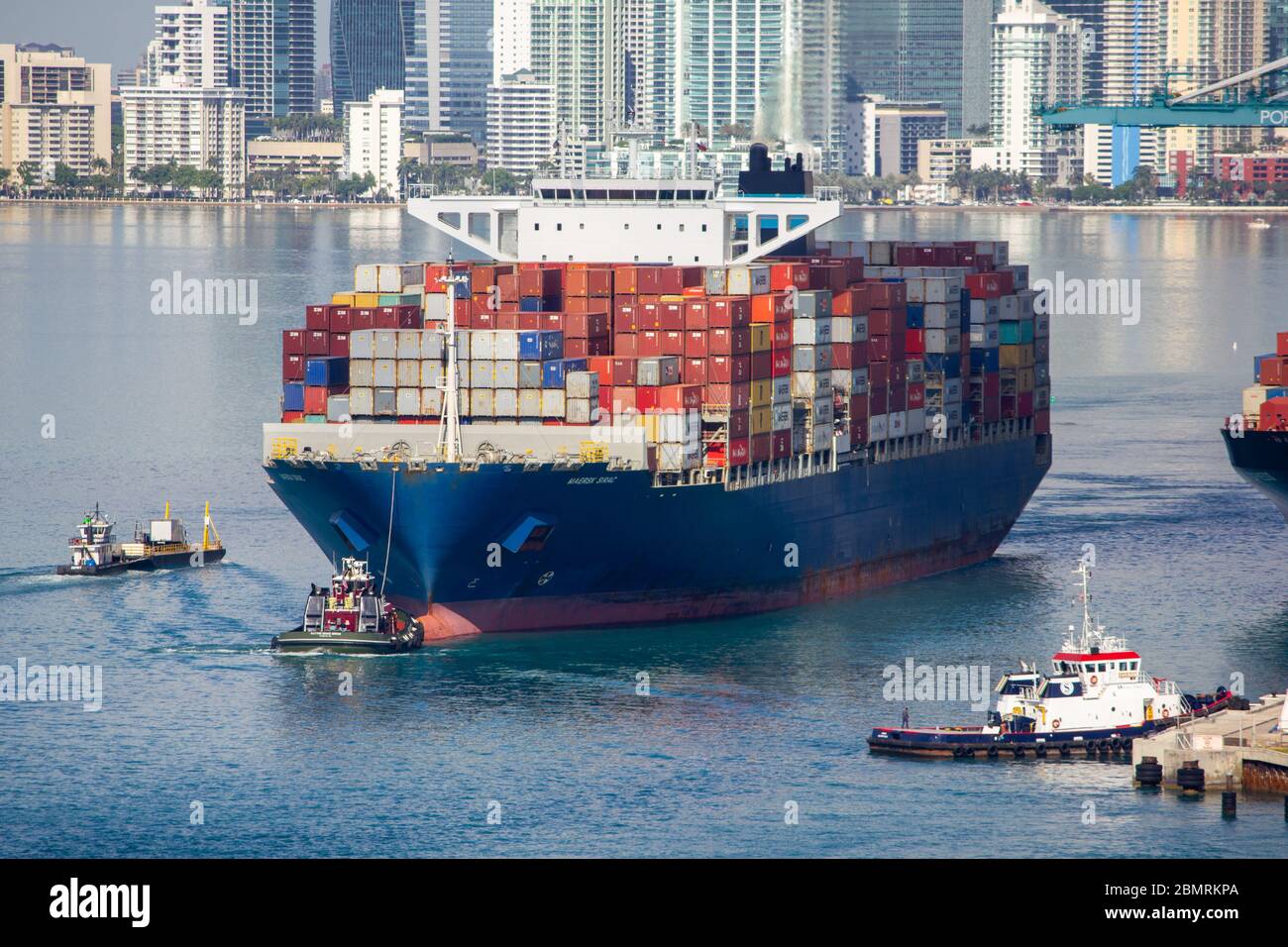 Miami Beach, Florida, Container ships part full leave port past fisher ...