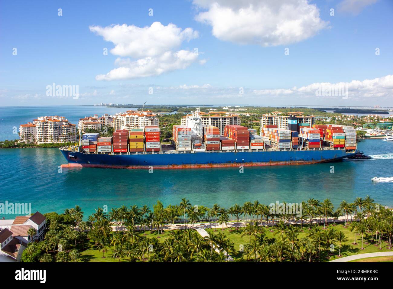 Miami Beach, Florida, Container ships part full leave port past fisher ...