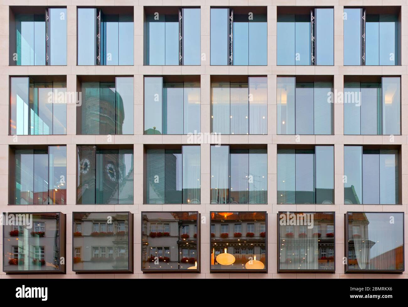 Old building architecture reflected in modern building. Front view of ...