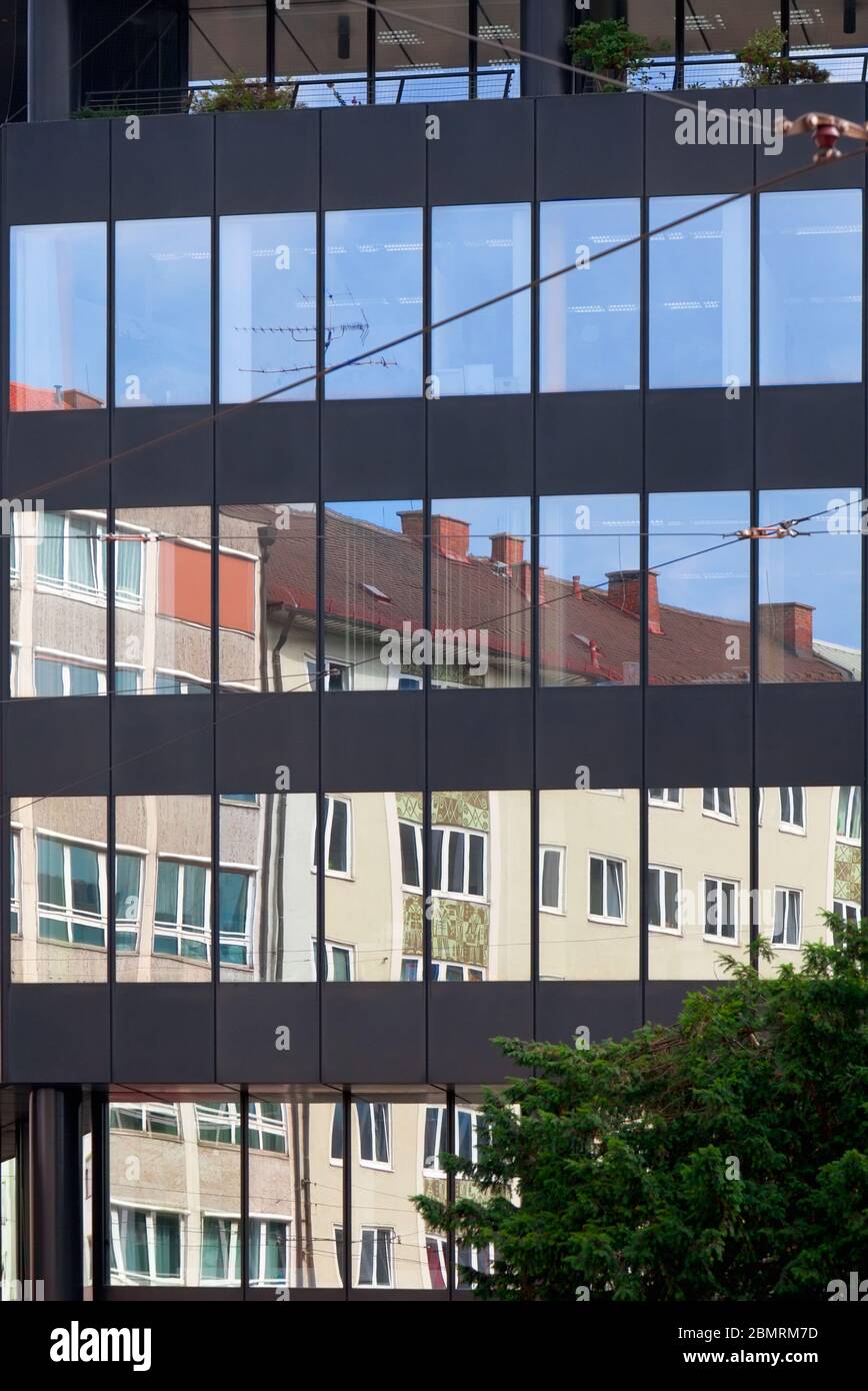 Old building architecture reflected in modern building. Front view of ...