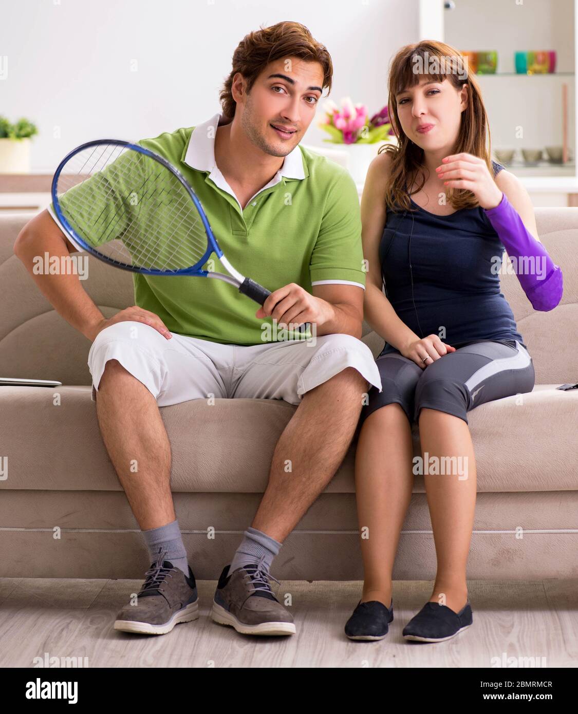 The man and woman discussing elbow strap Stock Photo - Alamy