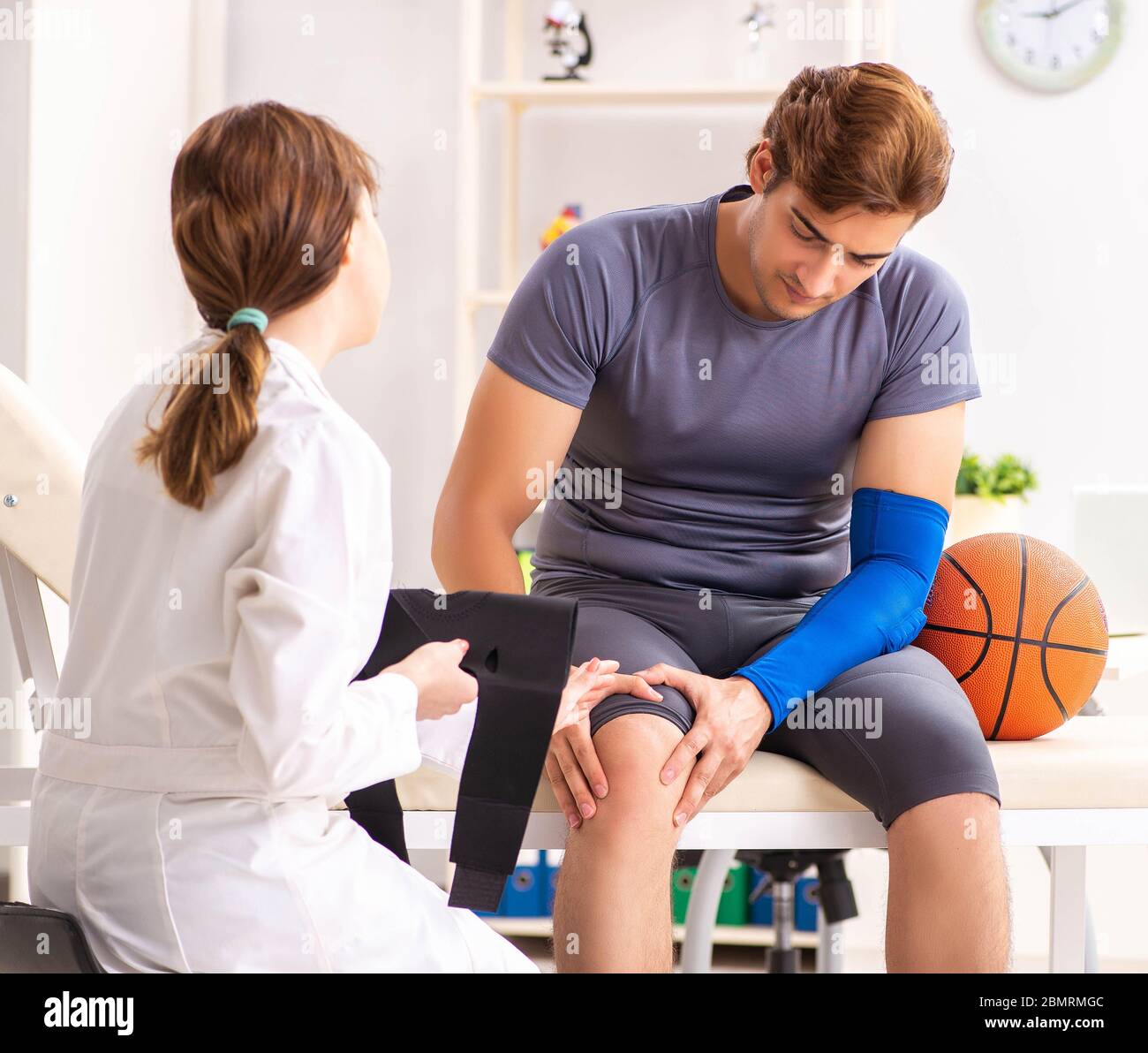 The handsome basketball player visiting female doctor traumatologist ...