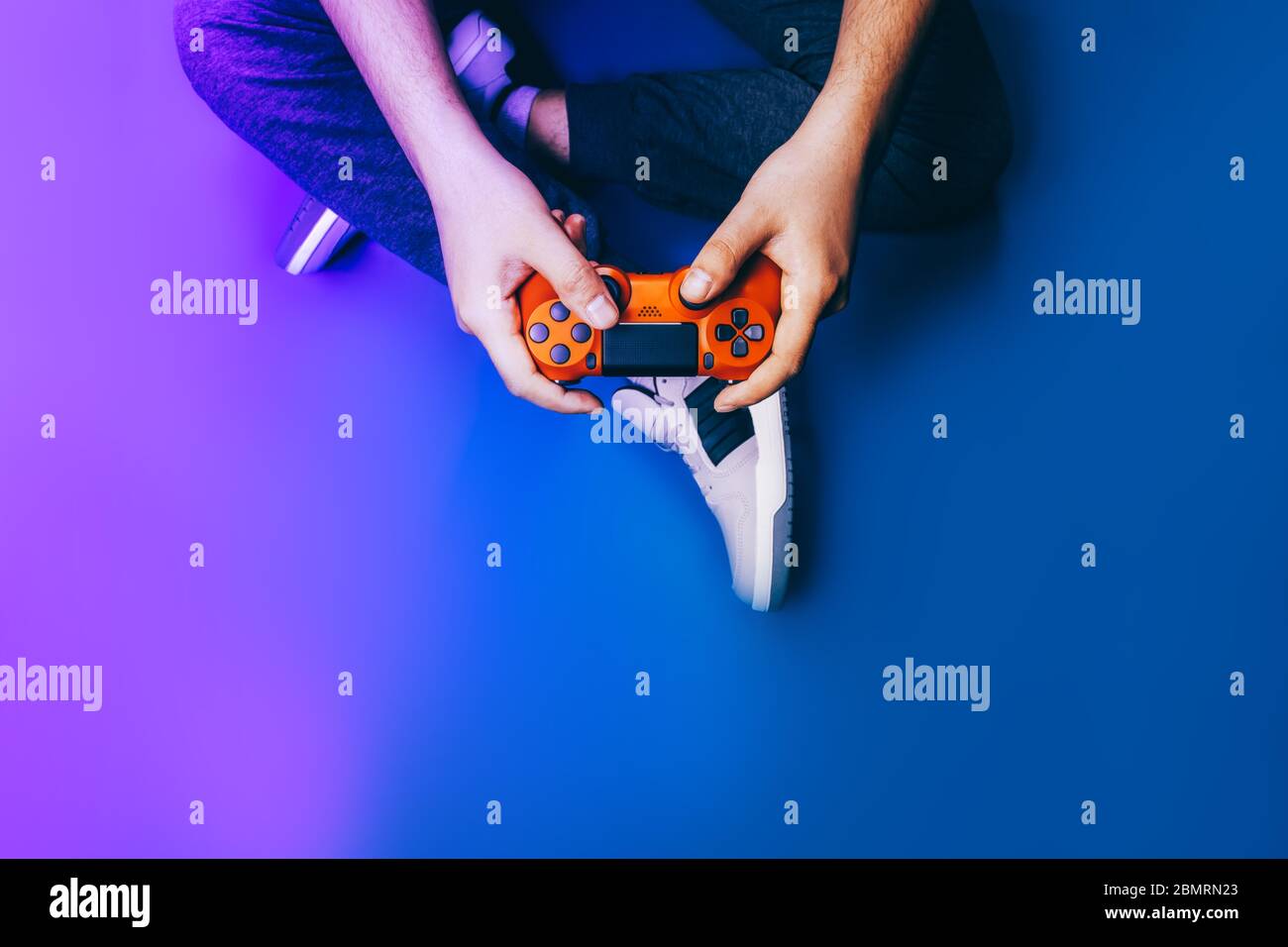 Young guy plays video games Stock Photo - Alamy