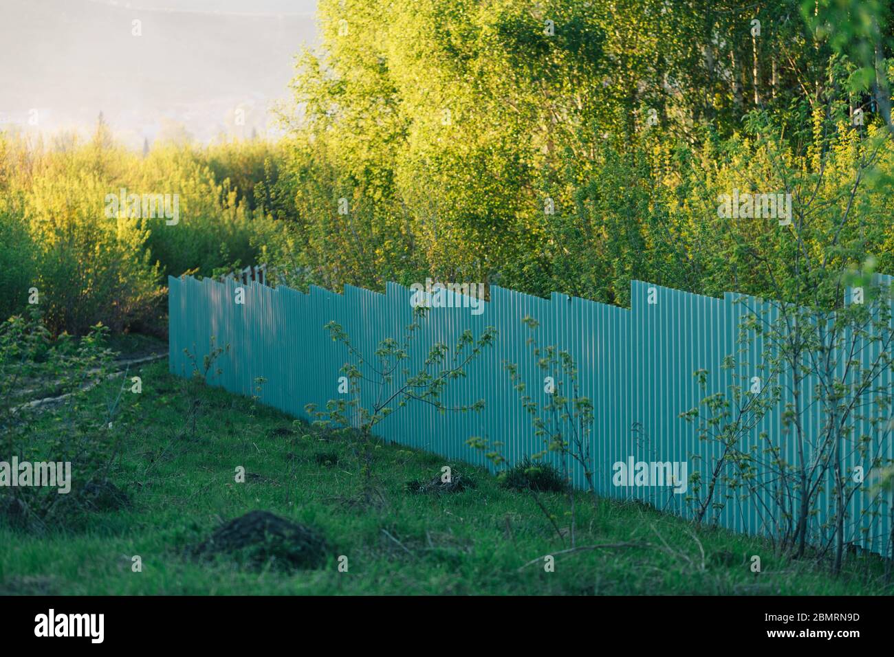 Metal gray fence made of profiled sheet, full insulation from the ...