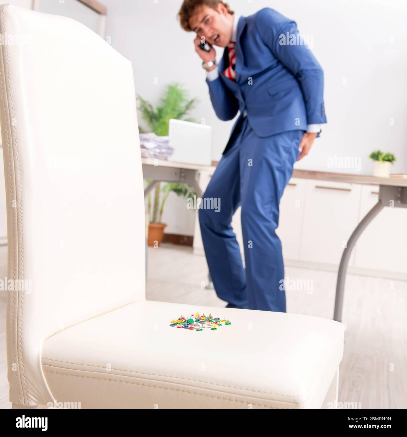 The office prank with sharp thumbtacks on chair Stock Photo - Alamy