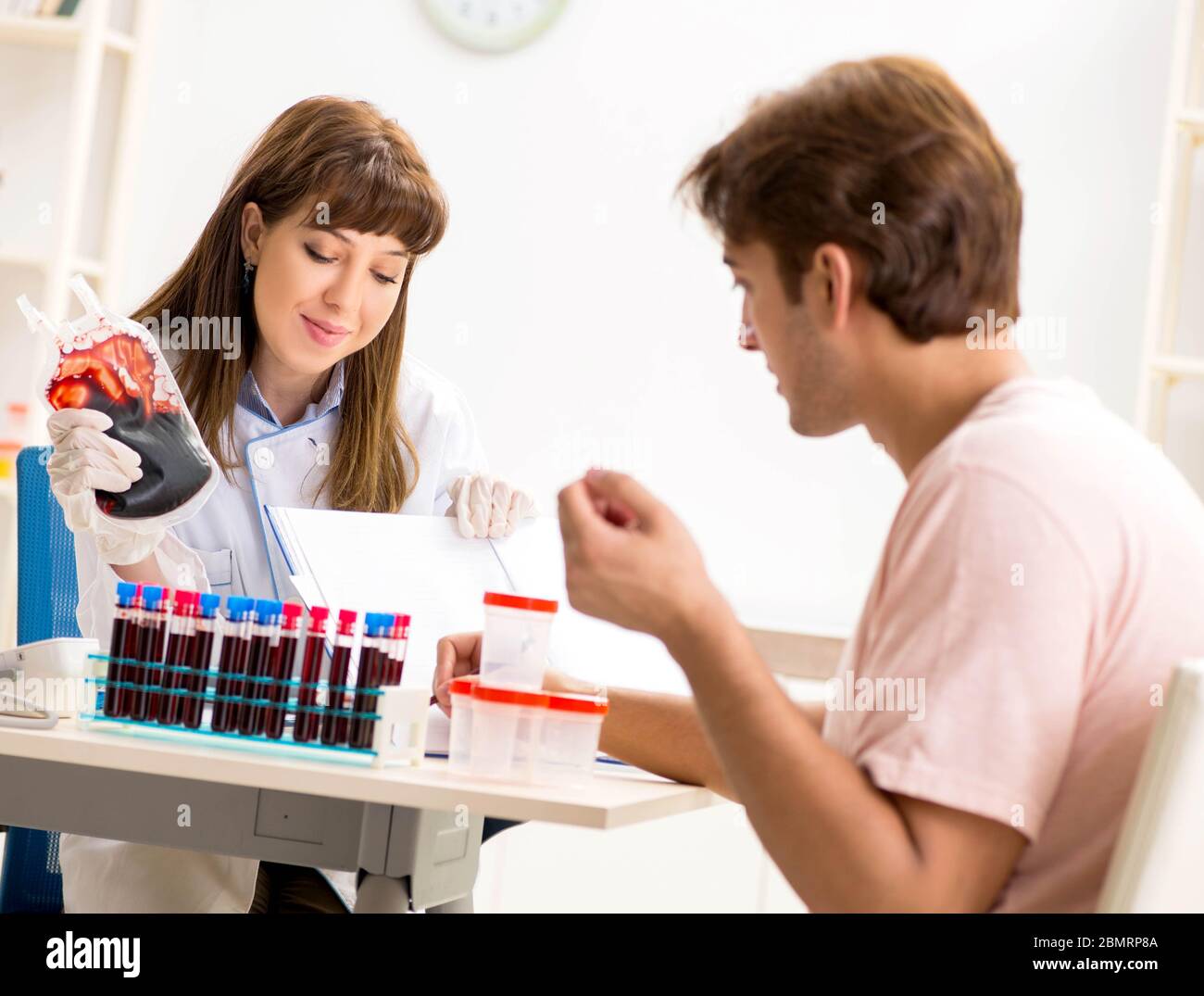 The man giving his blood as a donor Stock Photo - Alamy