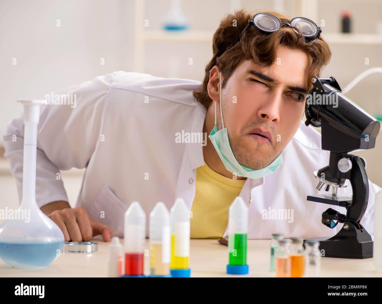 The funny crazy chemist doing experiments and tests Stock Photo - Alamy