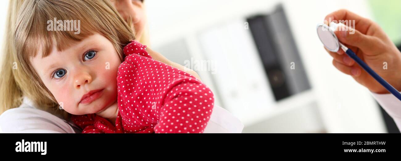Little child with stethoscope at doctor reception Stock Photo - Alamy