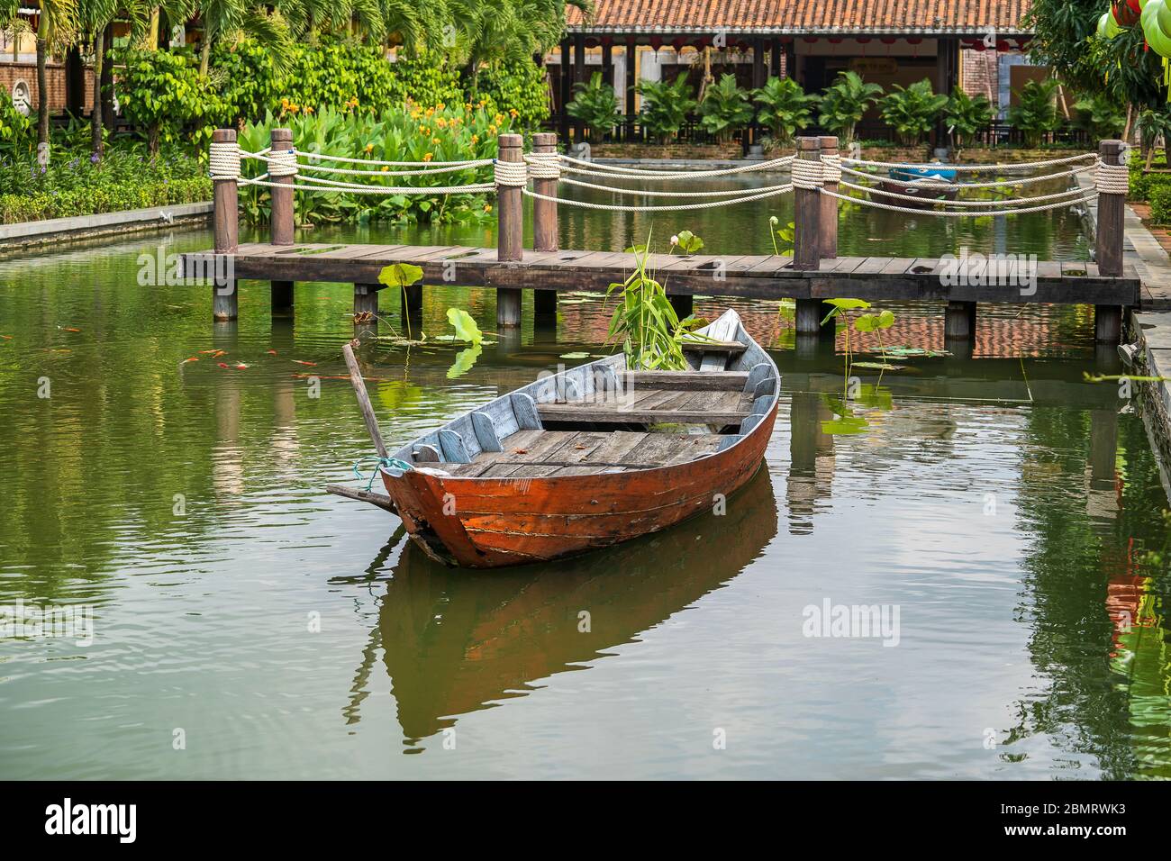Small wooden boat on the Lang Co Bay, where you can see the bridge on ...