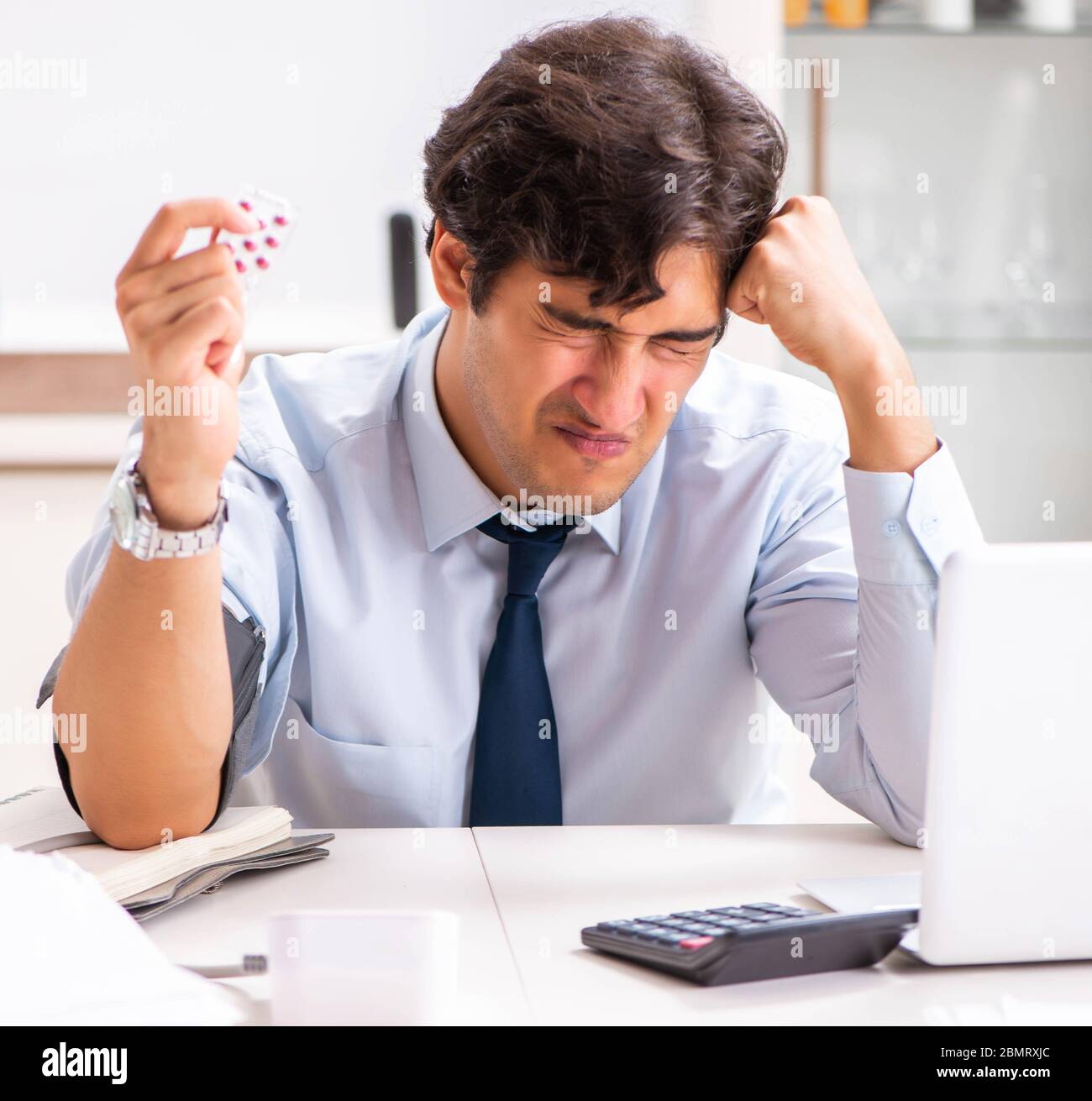 The man under stress measuring his blood pressure Stock Photo - Alamy