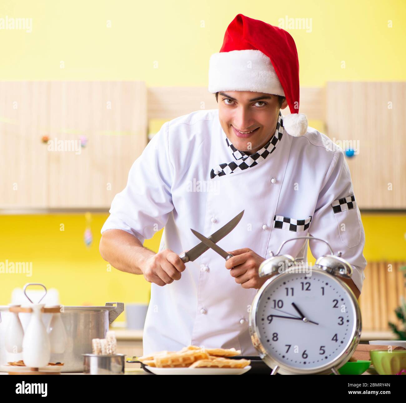 The young chef husband working in kitchen at christmas eve Stock Photo ...