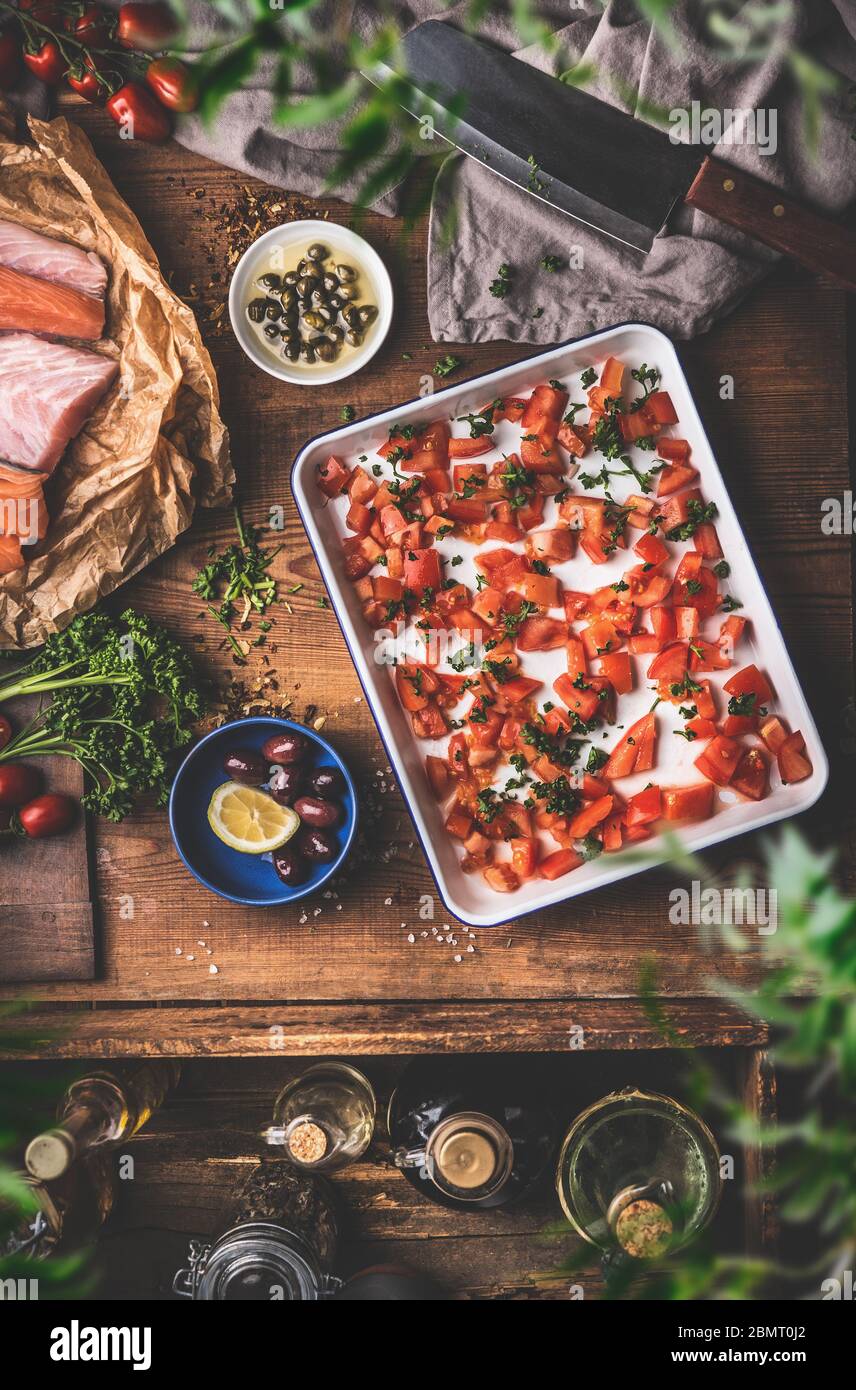 Fish lay tomatoes on baking hi-res stock photography and images - Alamy