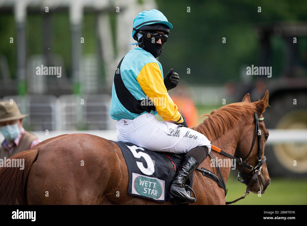 Jockey Lilli-Marie ENGELS with mouth-nose mask on Great Secret. Gallop ...