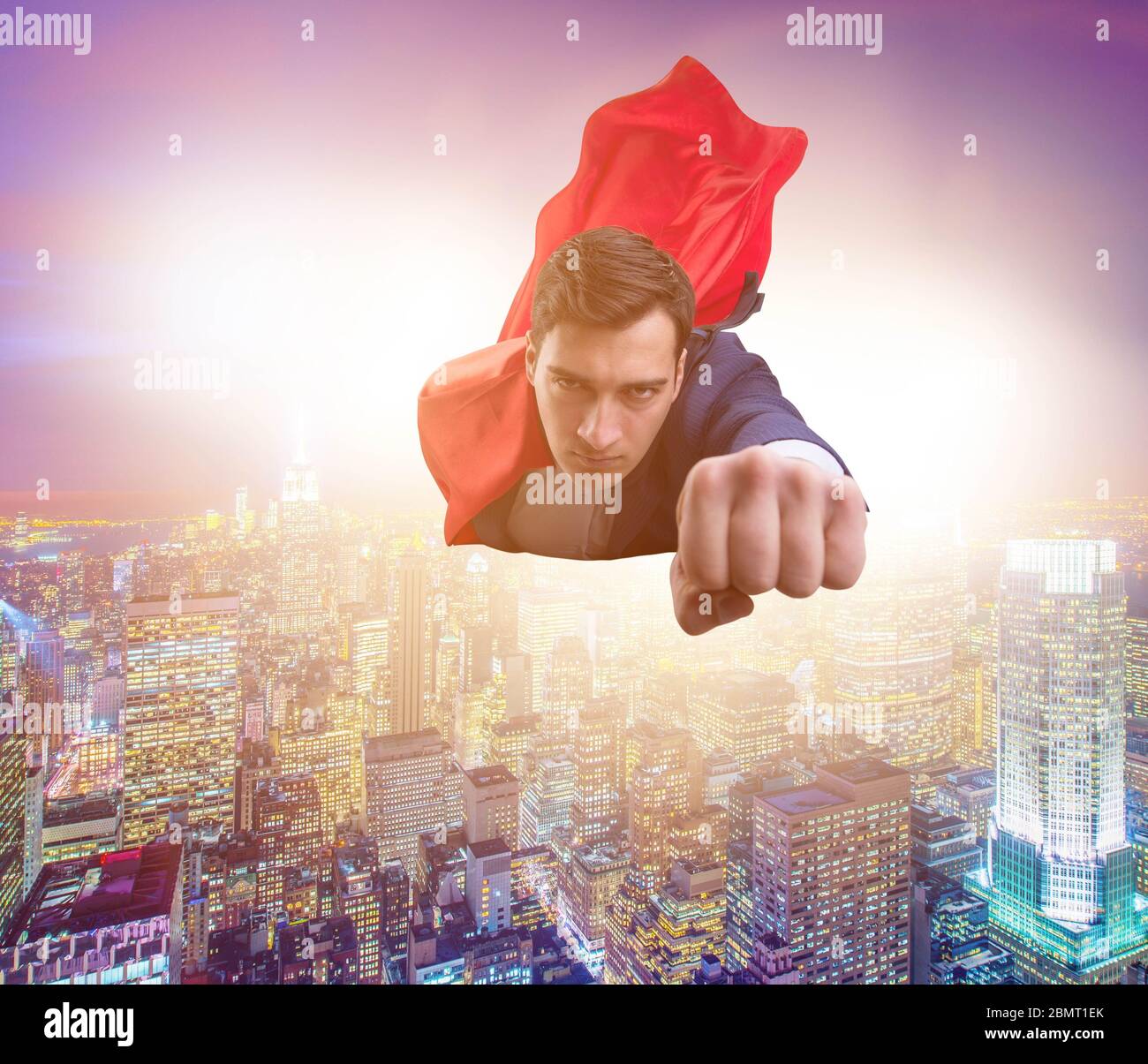 The superhero businessman flying over the city Stock Photo - Alamy