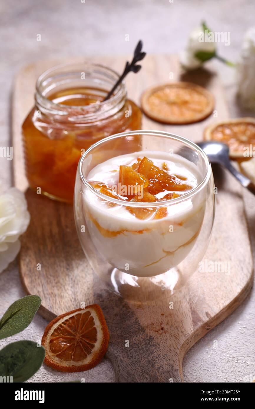 fresh yogurt for breakfast with orange jam Stock Photo - Alamy
