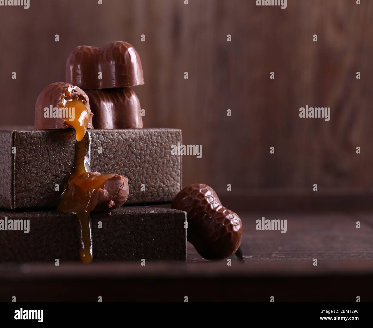 chocolate candies pralines with caramel Stock Photo - Alamy