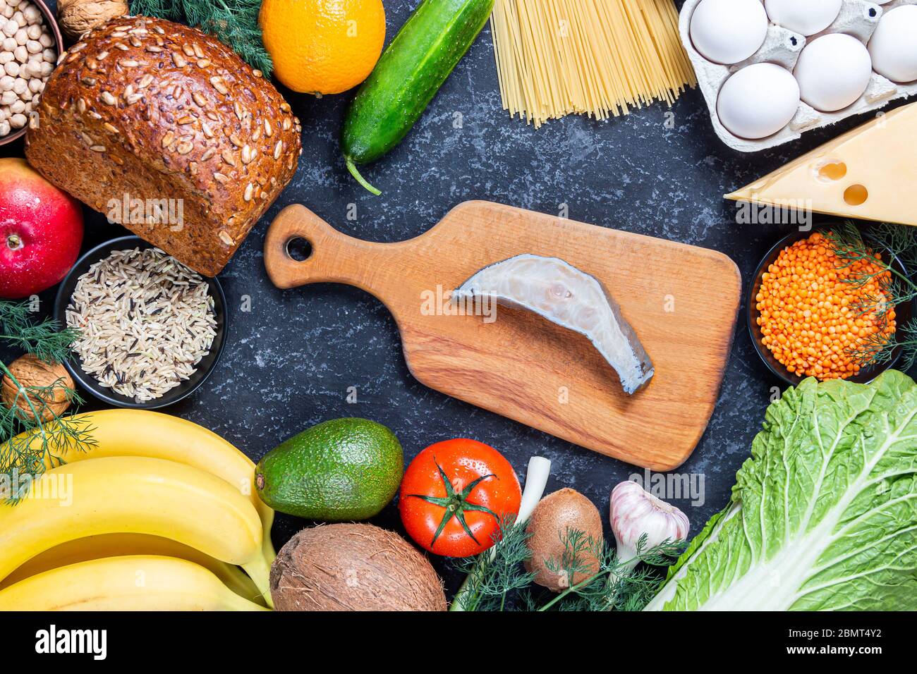 Conceptual image of healthy food balance with fish steak, vegetables ...
