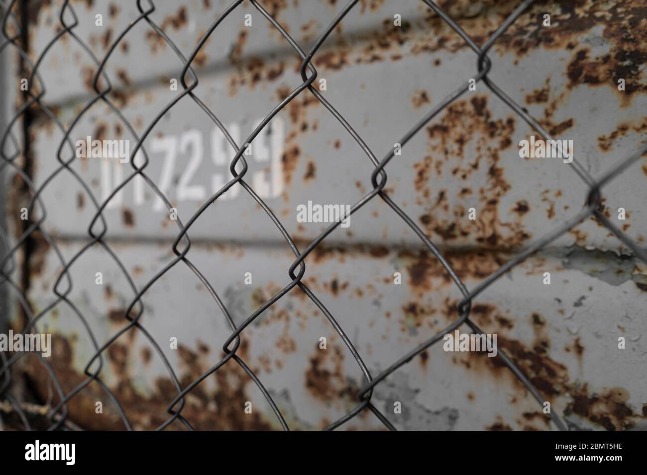 rusty background through metal mesh Stock Photo - Alamy