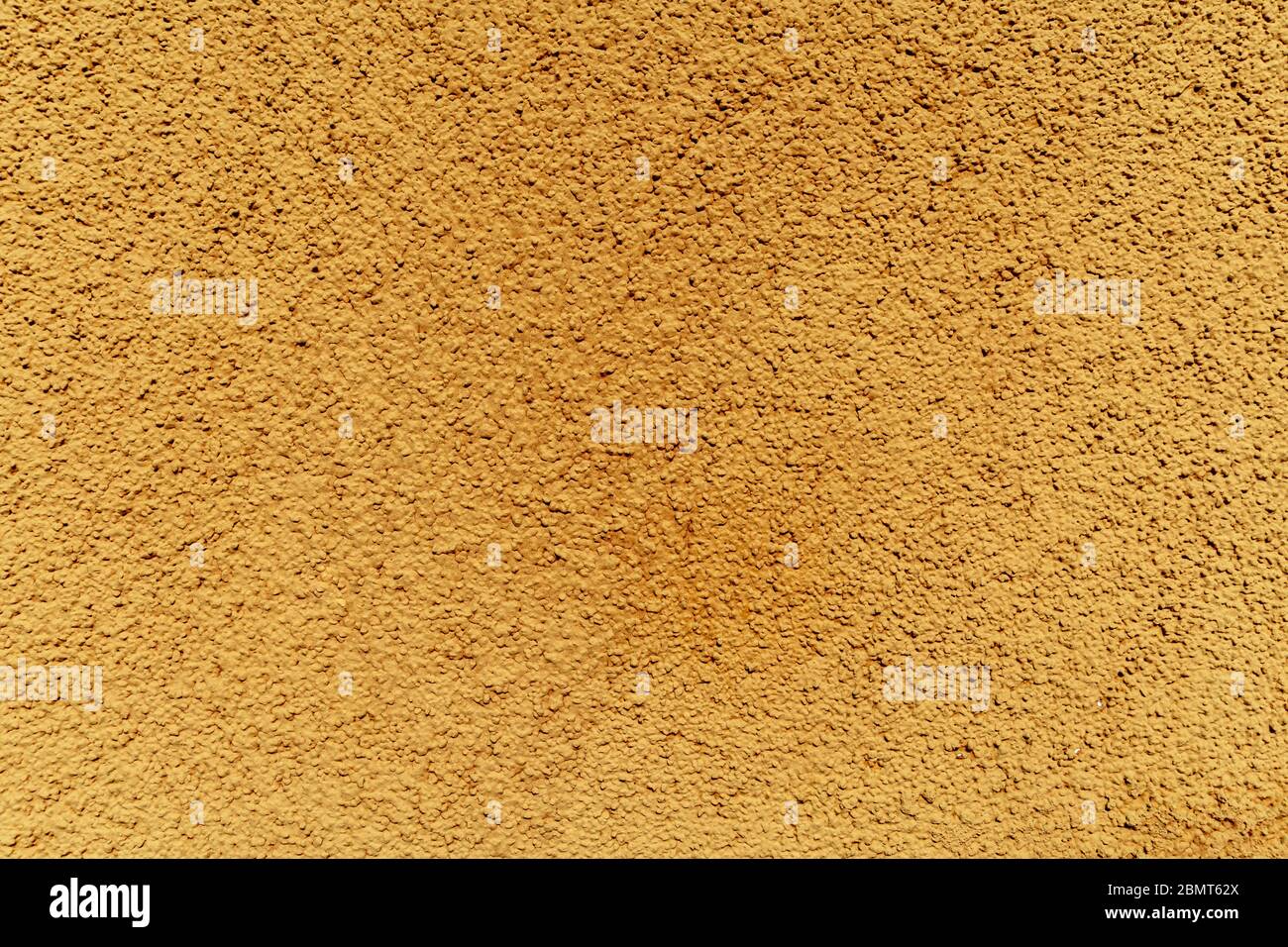 yellow background with a small stone texture Stock Photo - Alamy