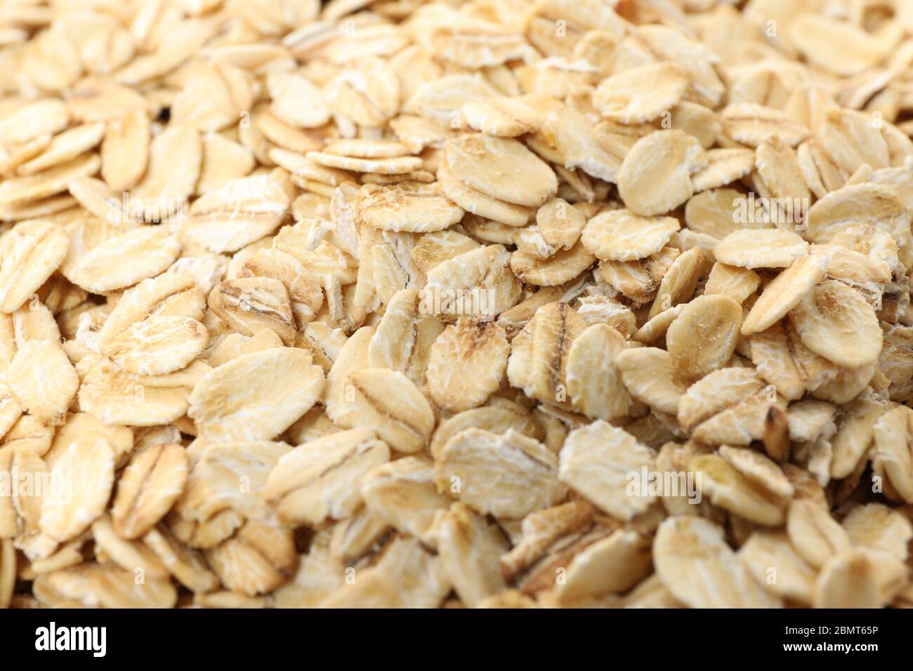 Oatmeal flakes texture on whole background, close up Stock Photo - Alamy