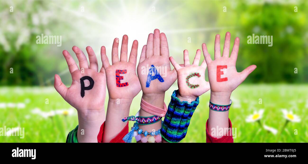 Children Hands Building Word Peace, Grass Meadow Stock Photo - Alamy