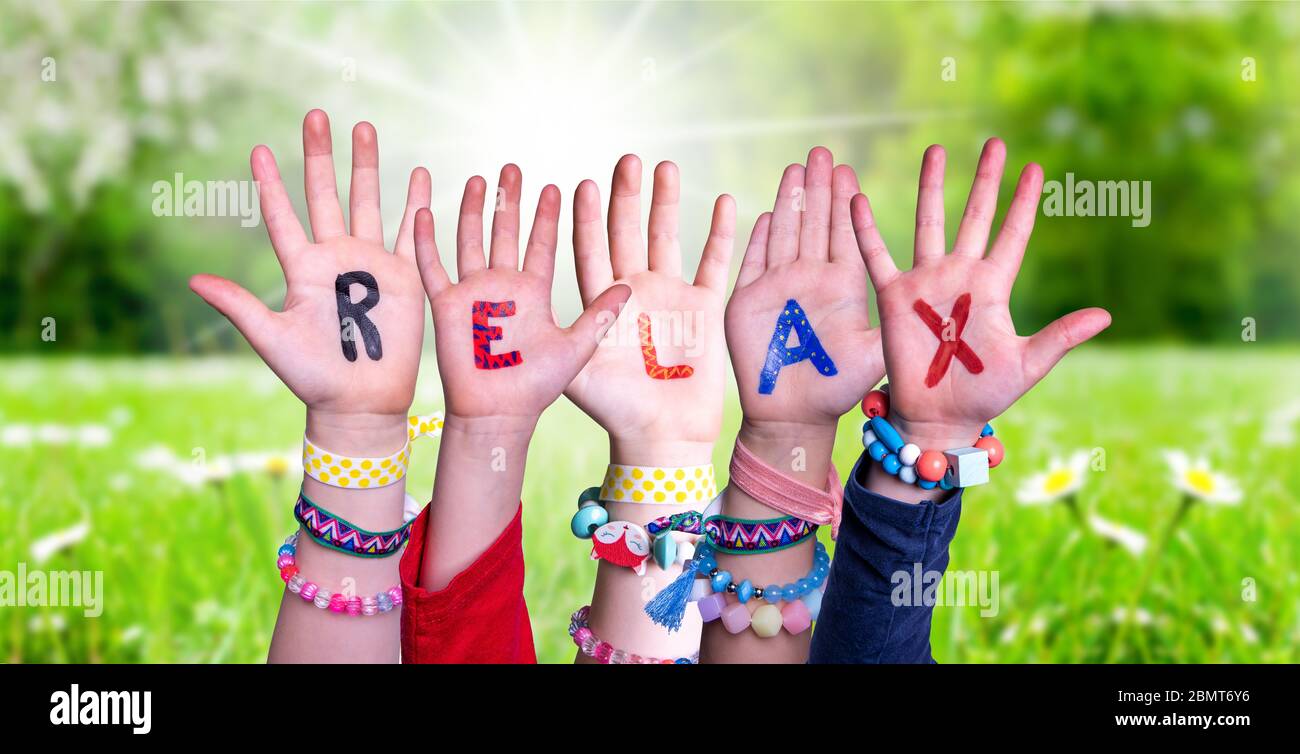 Children Hands Building Word Relax, Grass Meadow Stock Photo - Alamy