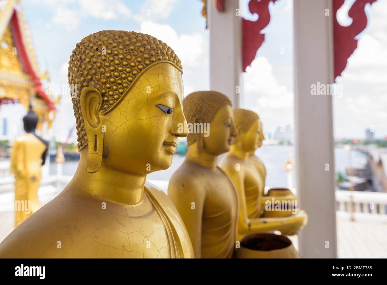 Portrait of golden Buddha statues in the Buddhist temple Stock Photo ...