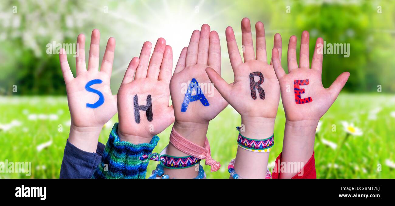 Children Hands Building Word Share, Grass Meadow Stock Photo - Alamy