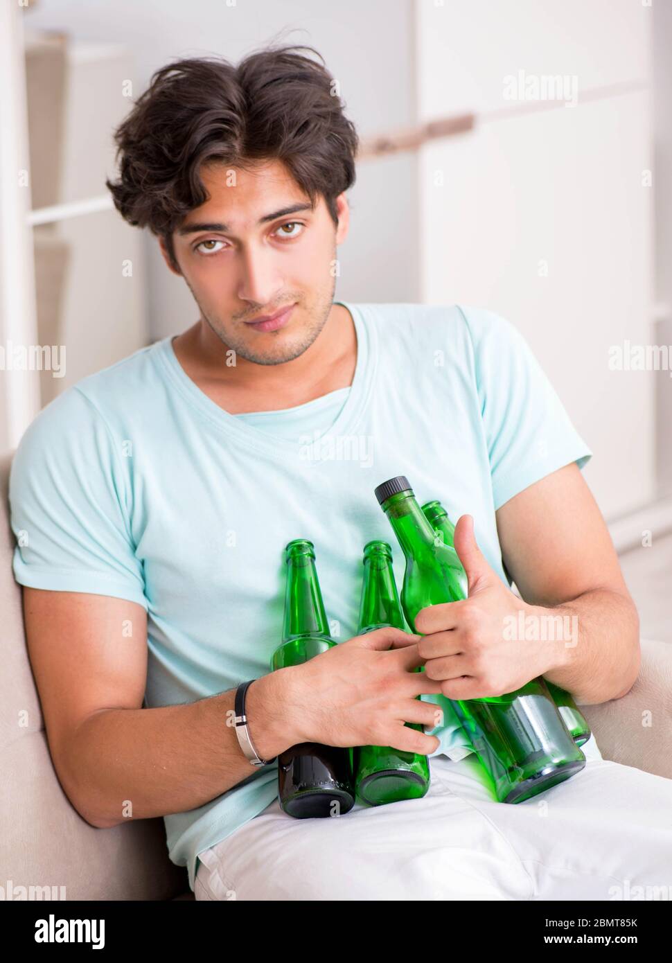 The young drunk handsome man after party at home Stock Photo - Alamy