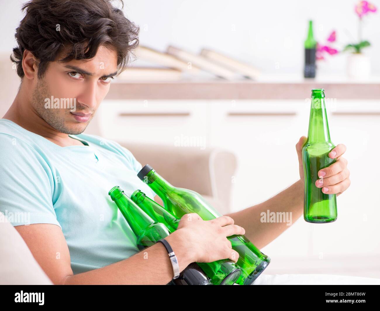 The young drunk handsome man after party at home Stock Photo - Alamy