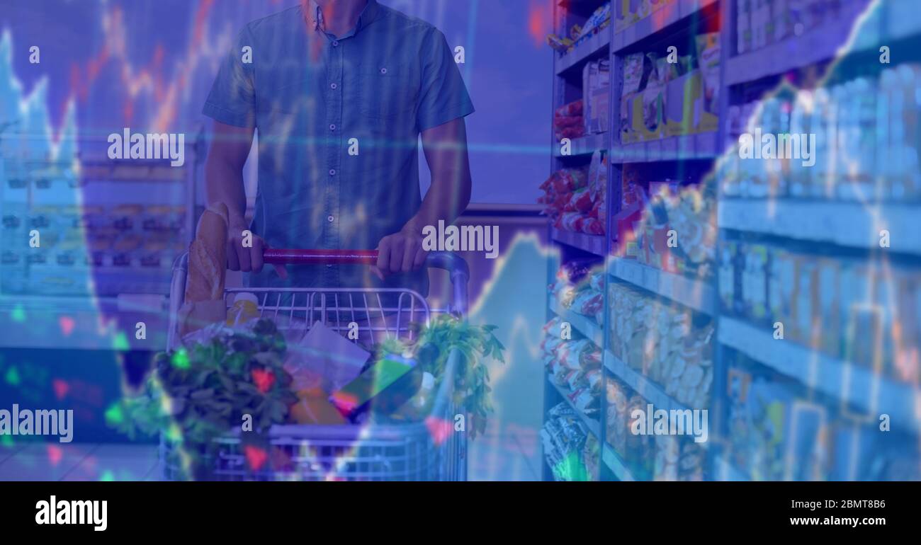 Caucasian man doing errands in a shop shelf, pulling a cart over ...