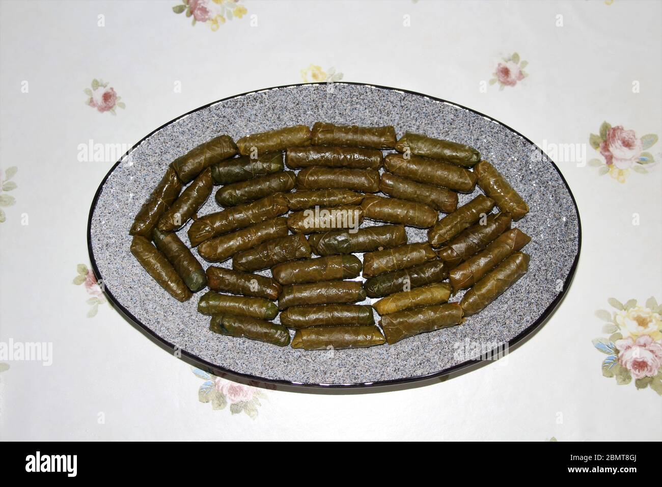 Traditional Turkish Dolma, Sarma or Dolmades on grey plate top view ...
