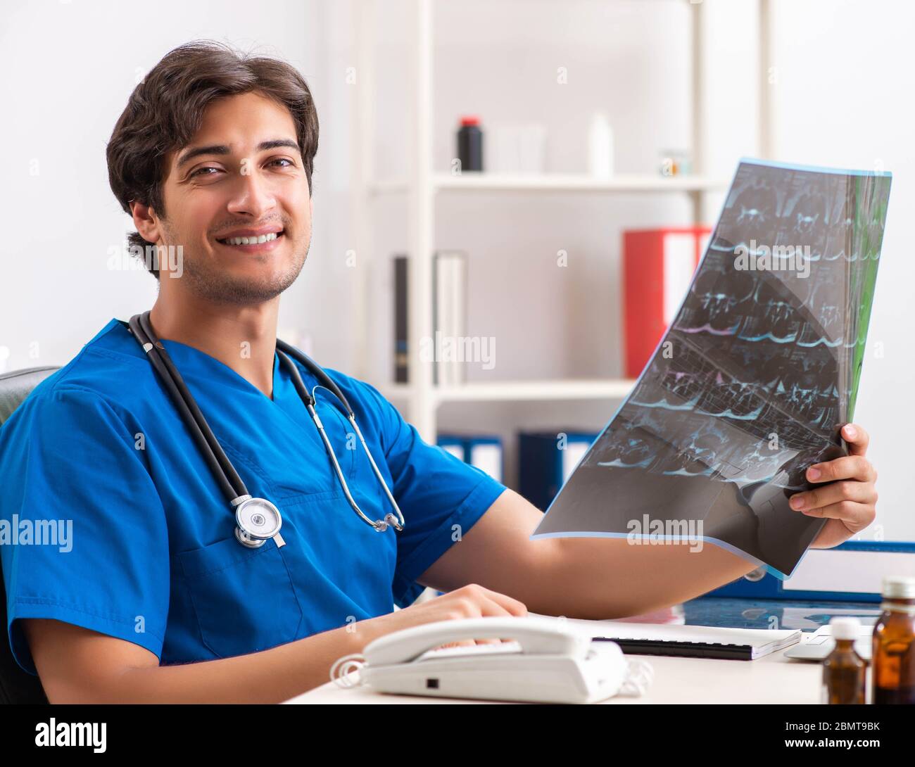 The male doctor radiologist with x-ray can image Stock Photo - Alamy