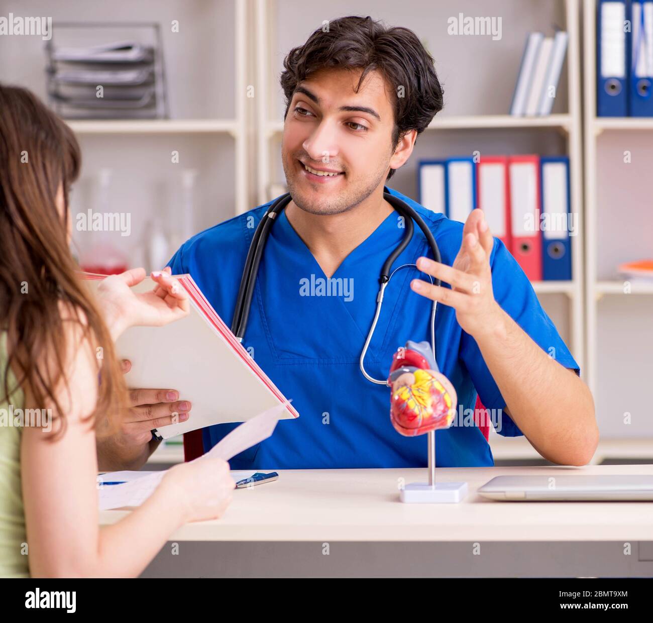The young patient visiting doctor cardiologist Stock Photo - Alamy