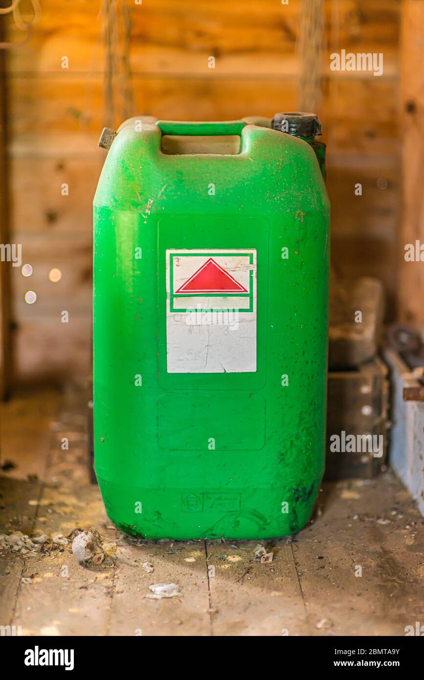 Green plastic container in a shed Stock Photo - Alamy