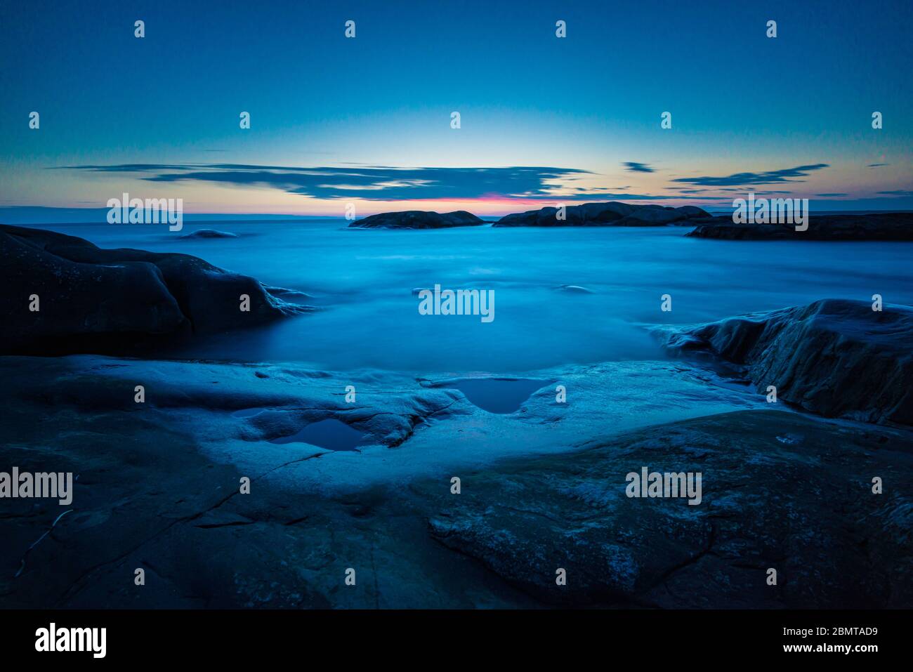 Sunset over islands and a small bay. Long exposure Stock Photo - Alamy