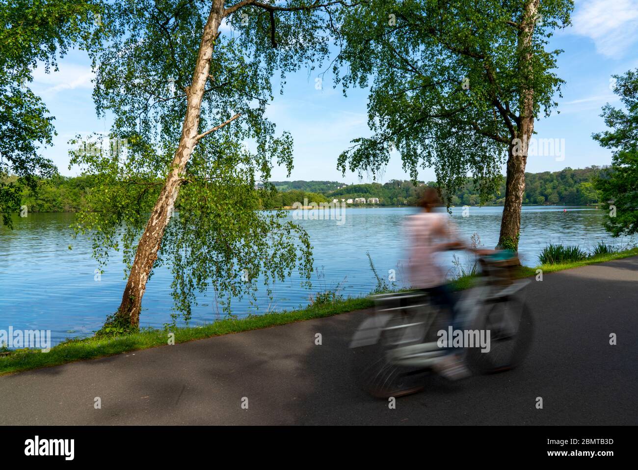 Cycling on the river Ruhr, lakeside path at Lake Baldeney in Essen, NRW ...
