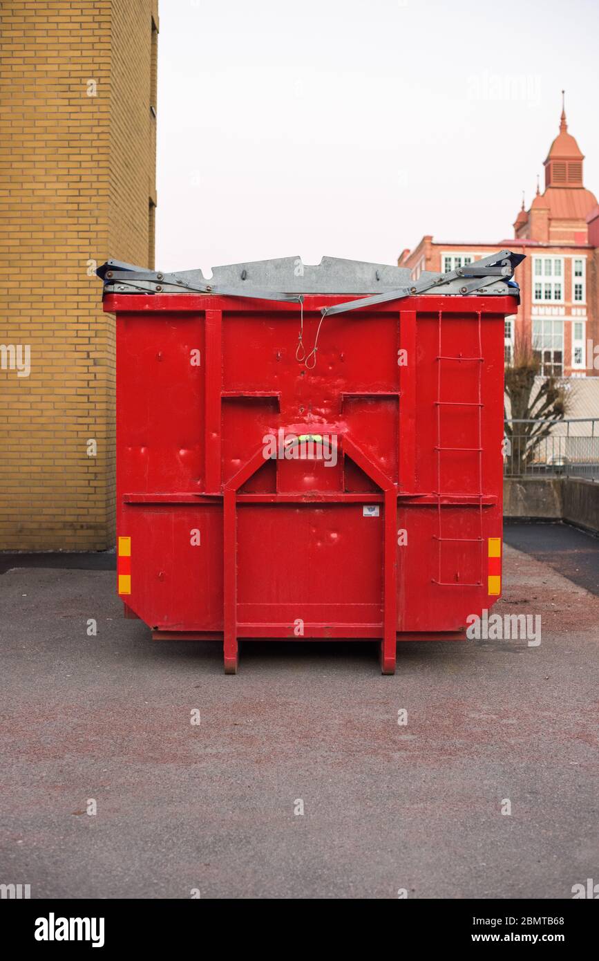 Red trash container with a sad face on it Stock Photo - Alamy
