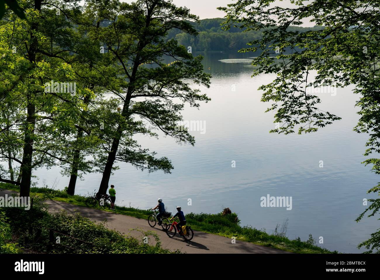 Cycling on the river Ruhr, lakeside path at Lake Baldeney in Essen, NRW ...