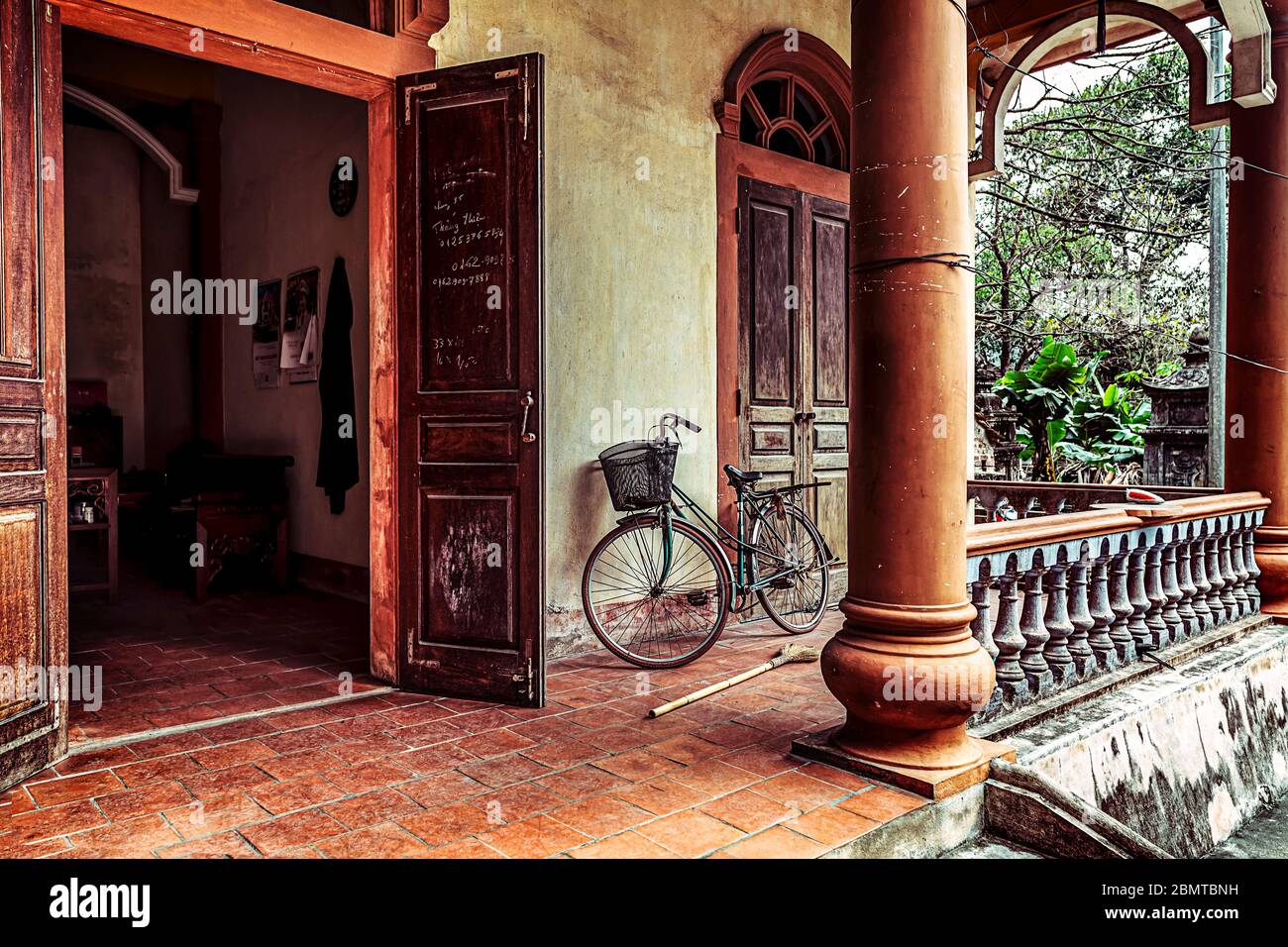 Terrace of asian house in forest with bycicle on it Stock Photo - Alamy