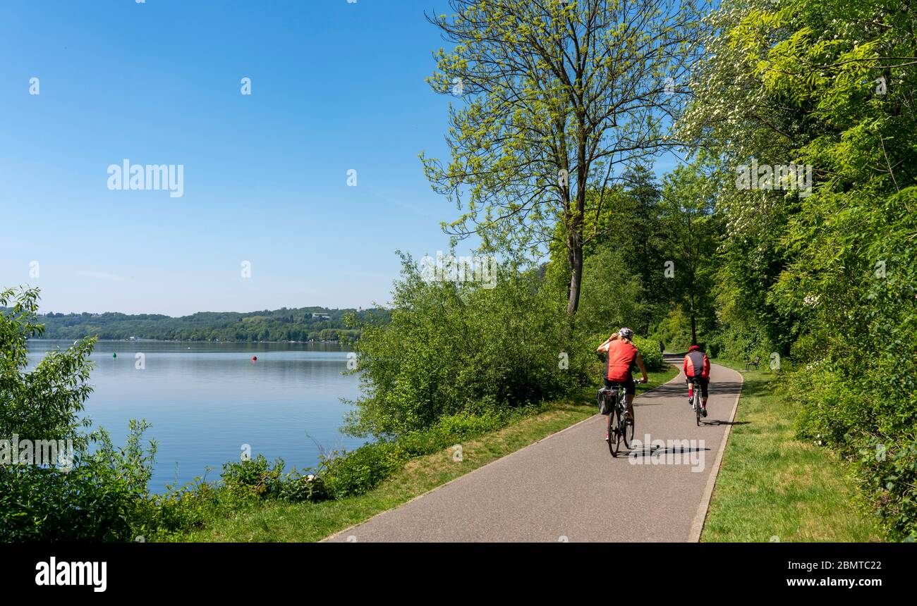 Cycling on the river Ruhr, lakeside path at Lake Baldeney in Essen, NRW ...