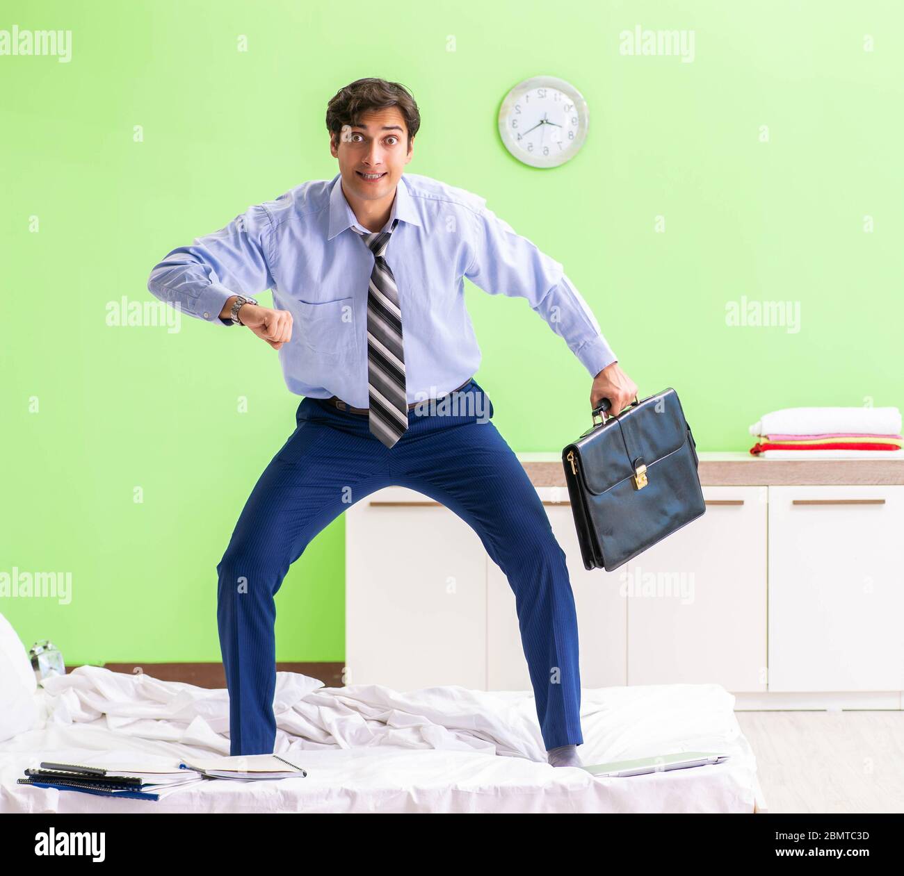 Man looking watch rushing work hi-res stock photography and images - Alamy
