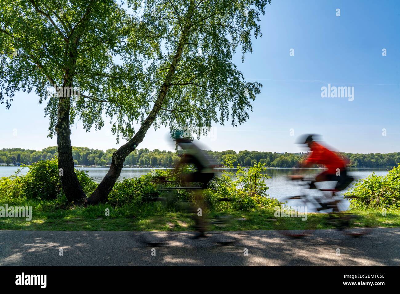 Cycling on the river Ruhr, lakeside path at Lake Baldeney in Essen, NRW ...