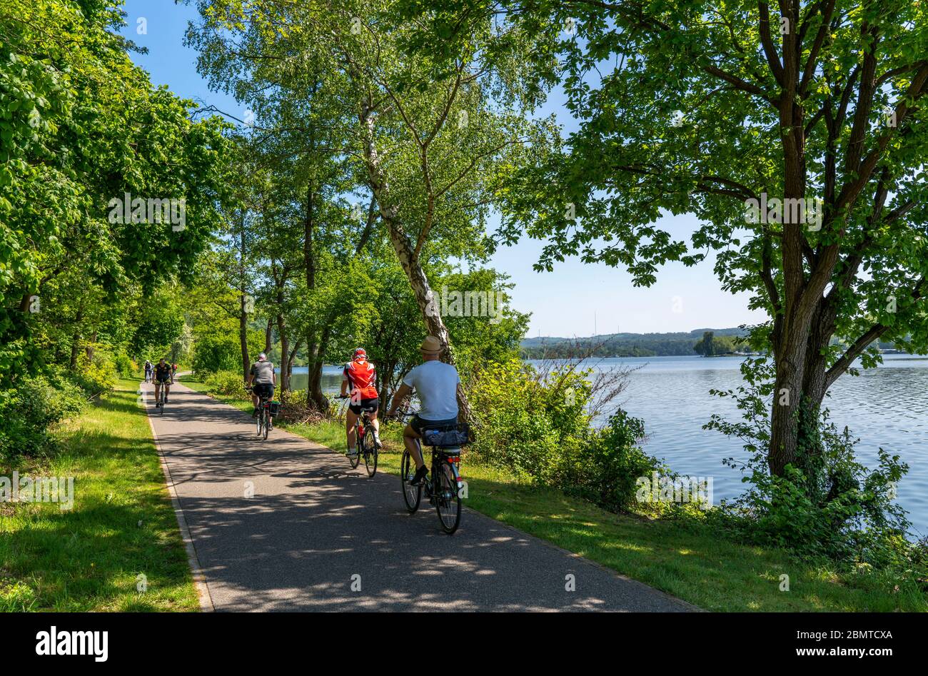 Cycling on the river Ruhr, lakeside path at Lake Baldeney in Essen, NRW ...