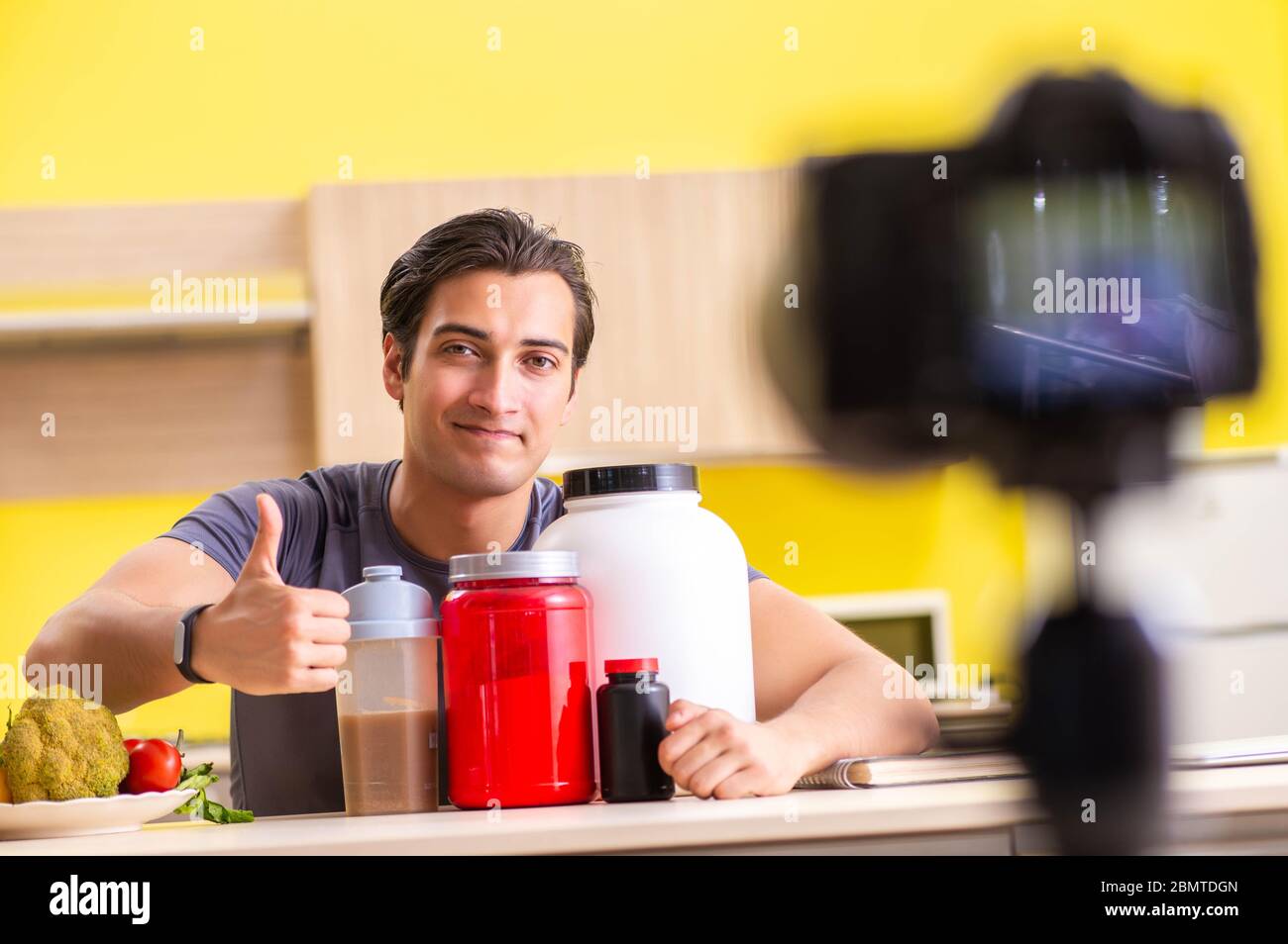 The young man blogging about food supplements Stock Photo - Alamy